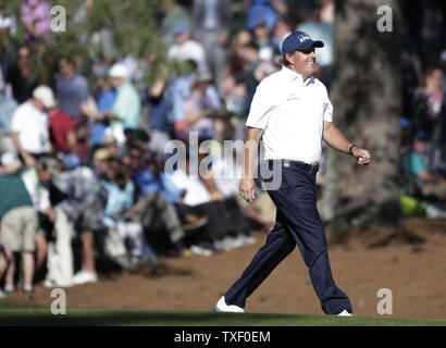 Phil Mickelson smiles on the putting green during the Par Three ...