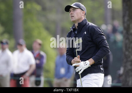 Patrick Reed watches his approach shot on the 1st hole during the third ...