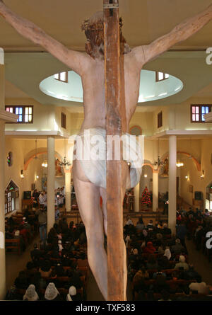 Christians attend a Christmas Mass in Mariam Nagar Church at Agartala ...