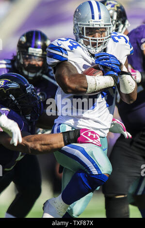 Dallas Cowboys running back Phillip Tanner gets up from the field after ...
