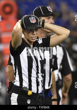 Line judge Sarah Thomas (53) signals a spot of the ball between the ...
