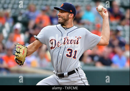 Detroit Tigers pitcher Ryan Carpenter throws a warmup pitch against the ...