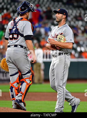 Detroit Tigers pitcher Ryan Carpenter throws a warmup pitch against the ...