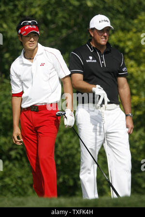 Ryo Ishikawa, of Japan, watches his shot on the 7th hole during the ...