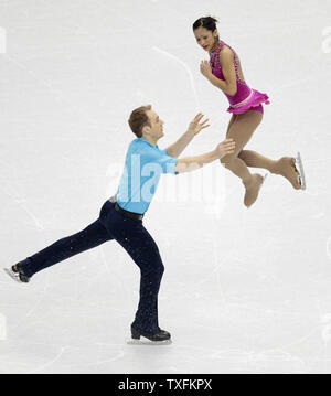 Amada Evora (R) and Mark Ladwig of the United States skate during their ...