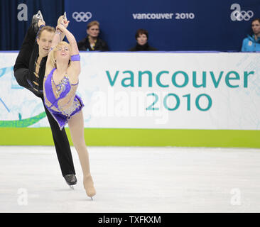 Caydee Denney and Jeremy Barrett, of the United States, skate during ...