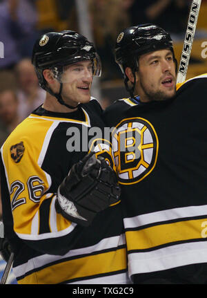 The Boston Bruins celebrate a goal by Boston Bruins left wing Cole Koepke as New York Islanders ...