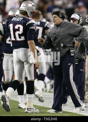 New England Patriots quarterback coach Jedd Fisch, left, works with ...