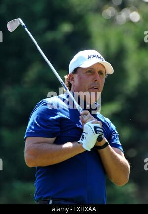 Phil Mickelson watches his drive off of the fourth tee box, during the ...