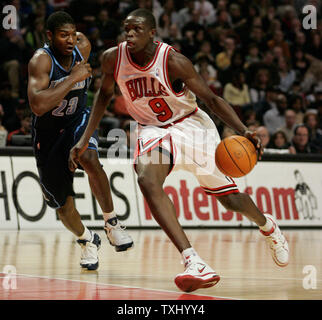 Chicago Bulls' Luol Deng drive to the basket while being guarded by ...