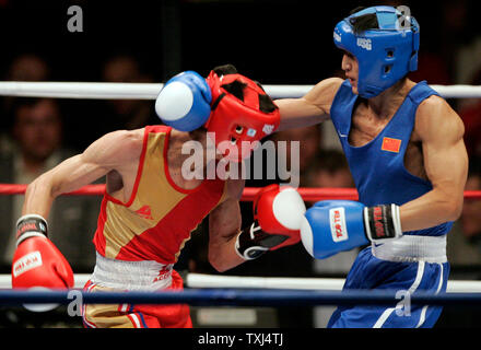 Harry Tanamor, right, of the Philippines, and Shiming Zou, of China ...
