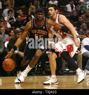 New Jersey Nets' Keyon Dooling (55) passes under the net between Golden ...