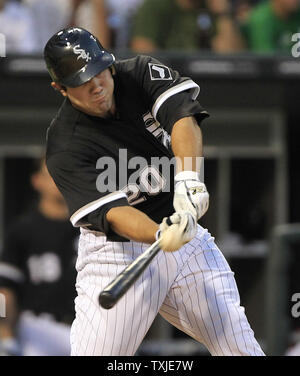 Chicago White Sox's Carlos Quentin follows through on a two-run double ...