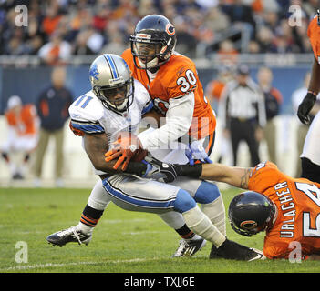 Detroit Lions defensive back Brian Branch (32) fights with Kansas City ...