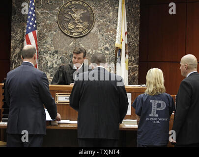 DuPage County Assistant State's Attorney Amanda Meindl , right stands ...