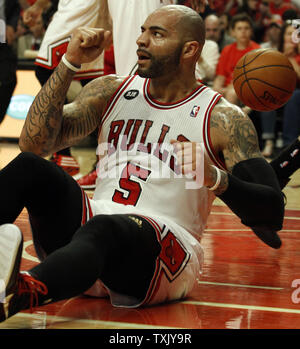 Chicago Bulls forward Carlos Boozer reacts after a score during the ...