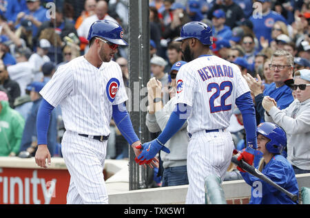 Chicago Cubs right fielder Kris Bryant, right, walks off the field with ...