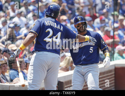 Milwaukee Brewers' Jesús Aguilar celebrates his home run with third ...