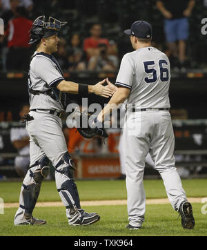 Chicago White Sox pitcher Jonathan Cannon reaches out for the baseball ...