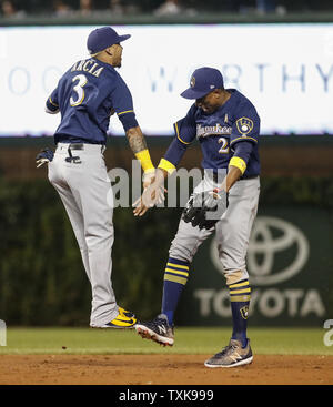 Milwaukee Brewers' Jacob Nottingham (26), Christian Yelich (22) and ...