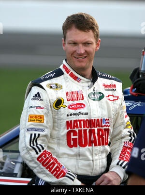 Dale Earnhardt Jr. stands with his 2008 cars after a press conference ...