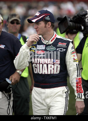 Dale Earnhardt Jr walks down pit road during qualifying for Saturday's ...