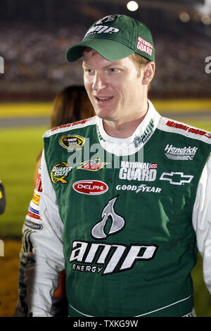 Dale Earnhardt Jr. stands by his car before the start of the Budweiser ...