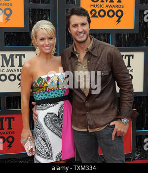 Luke Bryan (R) and wife Caroline arrive for the Country Music ...