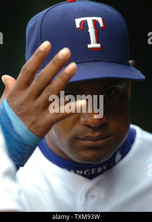 Texas Rangers' Sammy Sosa watches from the dugout during the baseball ...