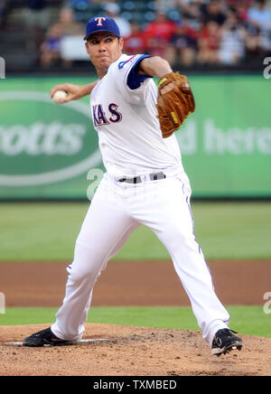 Texas Rangers starting pitcher Colby Lewis works against the St. Louis ...