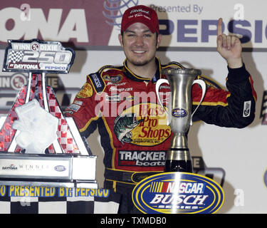 Martin Truex Jr., celebrates winning the NASCAR Cup series auto race in ...