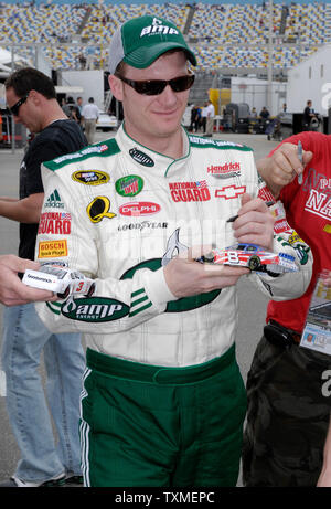 Dale Earnhardt Jr. signs autographs before practice for Sunday's NASCAR ...