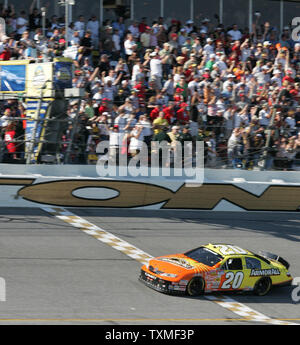 Tony Stewart takes the checkered flag in the Bass Pro Shops 500 NASCAR ...
