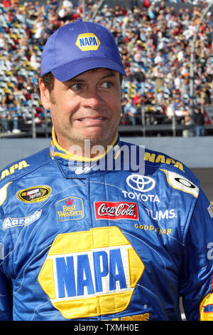 Michael Waltrip walks down pit row before the start of the Daytona 500 ...