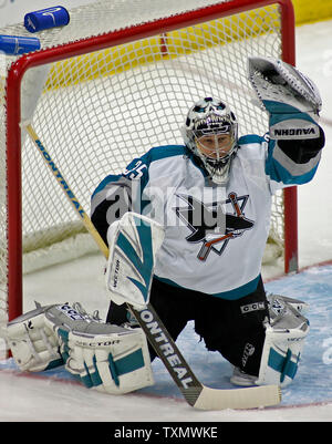 San Jose Sharks goalie Vesa Toskala, left, of Finland, waits for a shot ...