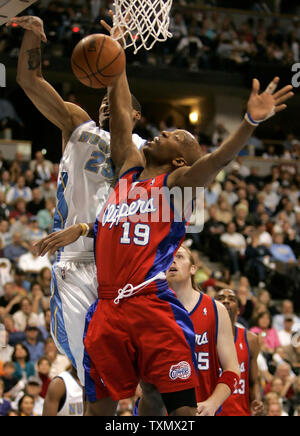 Los Angeles Clippers' Marcus Camby, right, loses the ball as he hits ...