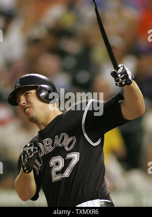 Colorado Rockies' Garrett Atkins watches the flight of his double off a ...