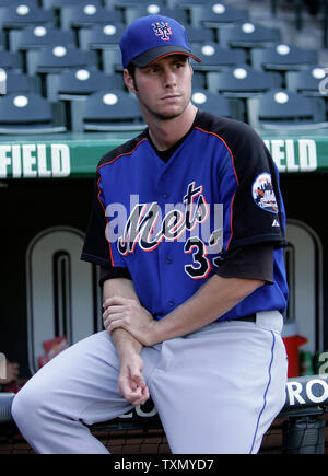 New York Mets pitcher John Maine winds up against the Colorado Rockies ...