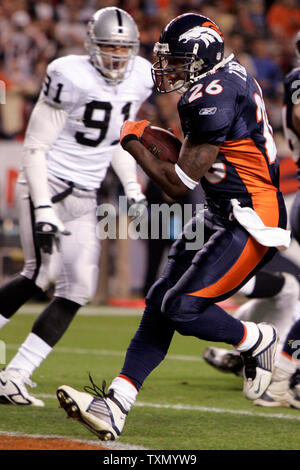 Denver Broncos running back Tyler Badie runs for a long gain in the ...