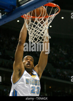 Denver Nuggets center Marcus Camby (L) blocks Houston Rockets Luuis ...
