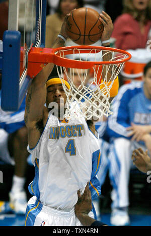 Denver Nuggets' Kenyon Martin dunks over Memphis Grizzlies' Pau Gasol ...
