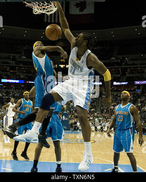 Denver Nuggets forward Nene, of Brazil, warms up before facing the ...