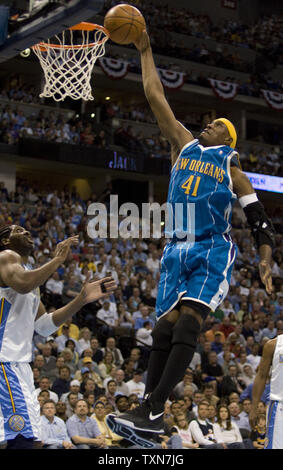 Denver Nuggets forward Nene, of Brazil, warms up before facing the ...