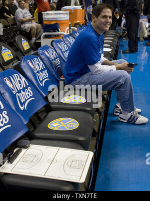 Dallas Mavericks team owner Mark Cuban walks to his seat during the ...