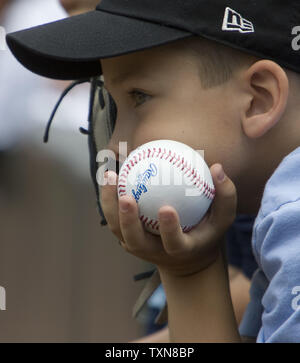 Colorado Rockies players warm up as the team practices in Coors Field ...