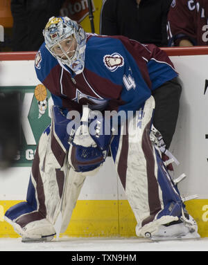 San Jose Sharks center Will Smith (2) reaches for the puck next to Detroit Red Wings defenseman ...
