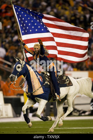 Ann Judge rides Denver Broncos mascot Thunder in the first half of an ...