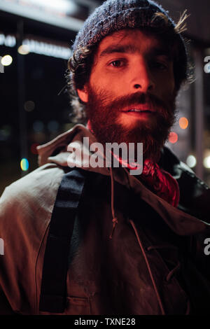 Bearded young man loitering on street Stock Photo - Alamy