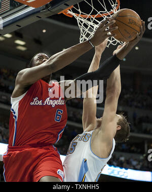 Denver Nuggets center DeAndre Jordan, third from left, pulls in a ...