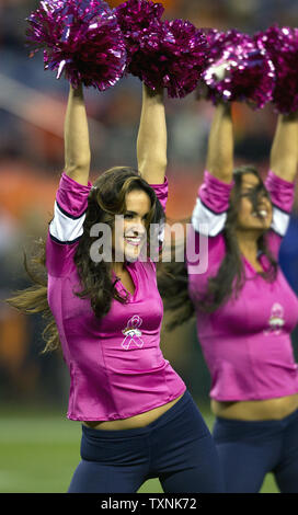 The Denver Broncos cheerleaders perform at Sports Authority Field at ...